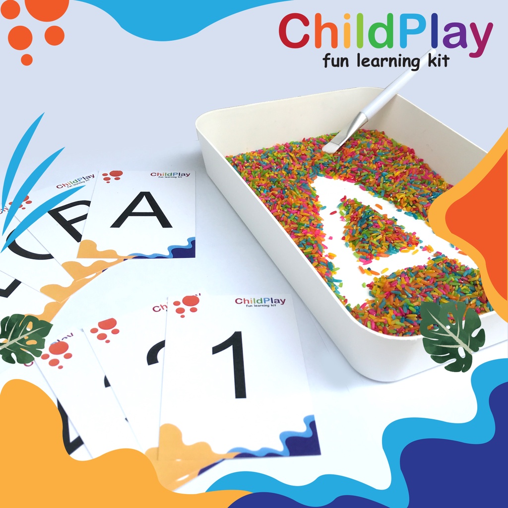 Montessori sensory play Motor letter writing in sprinkles tray writing ...