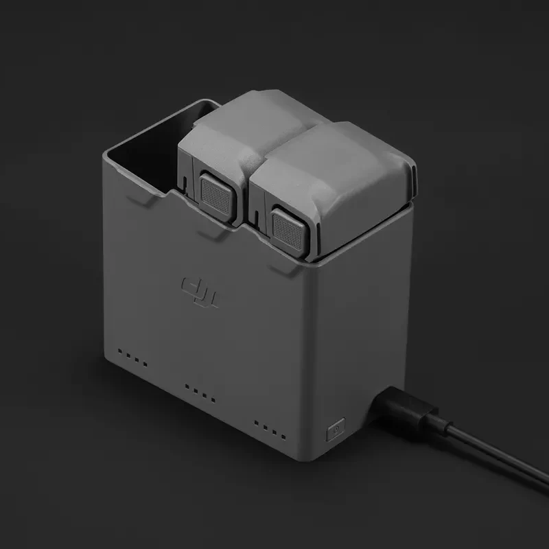 DJI Mini 5 Pro Two-Way Charging Hub Place batteries into the charging ...