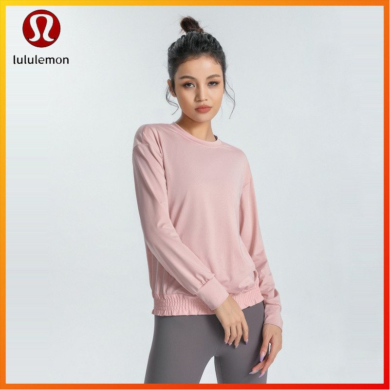 Lululemon's novel yoga attire for women featuring a long-sleeved, round ...