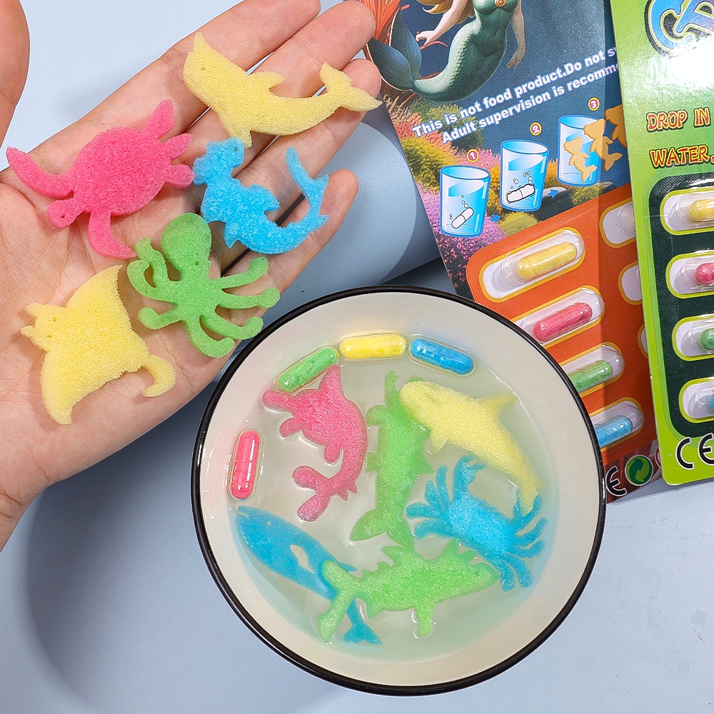 Cartoon Dinosaur Expands Sponge Capsule Toys Creative Soaking Water Sea ...