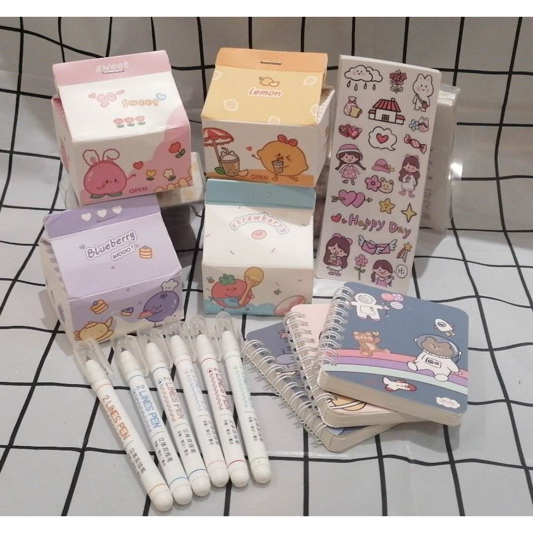Combo of a box of milk notes with a sticker, a pen and a DIY notebook ...