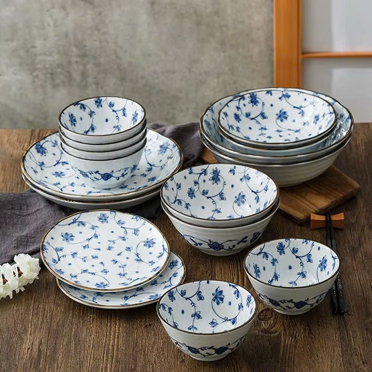 Japanese ceramic dinnerware set with blue flower pattern and brown ...